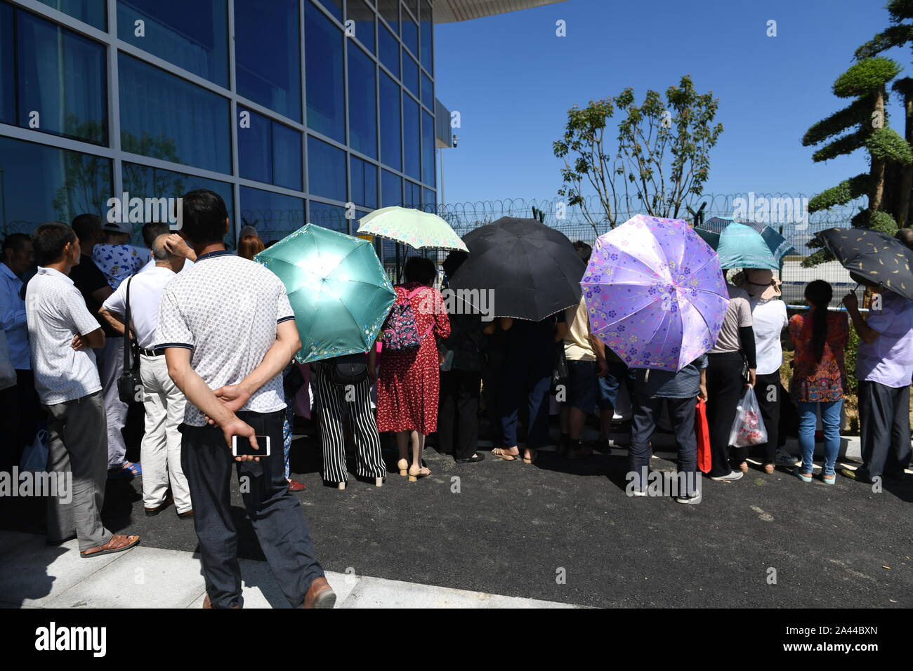 Local residents crowd the Chongqing Wushan Airport, dubbed a "high-in ...
