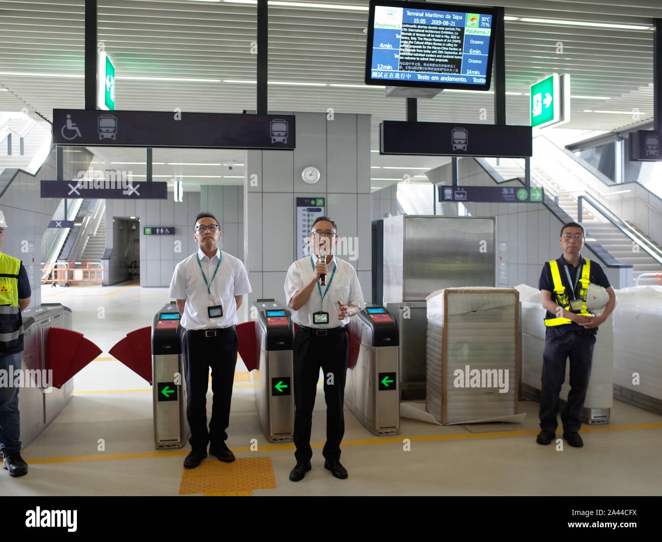 Chinese workers introduce the Light Rail Transit (LRT) system at the ...