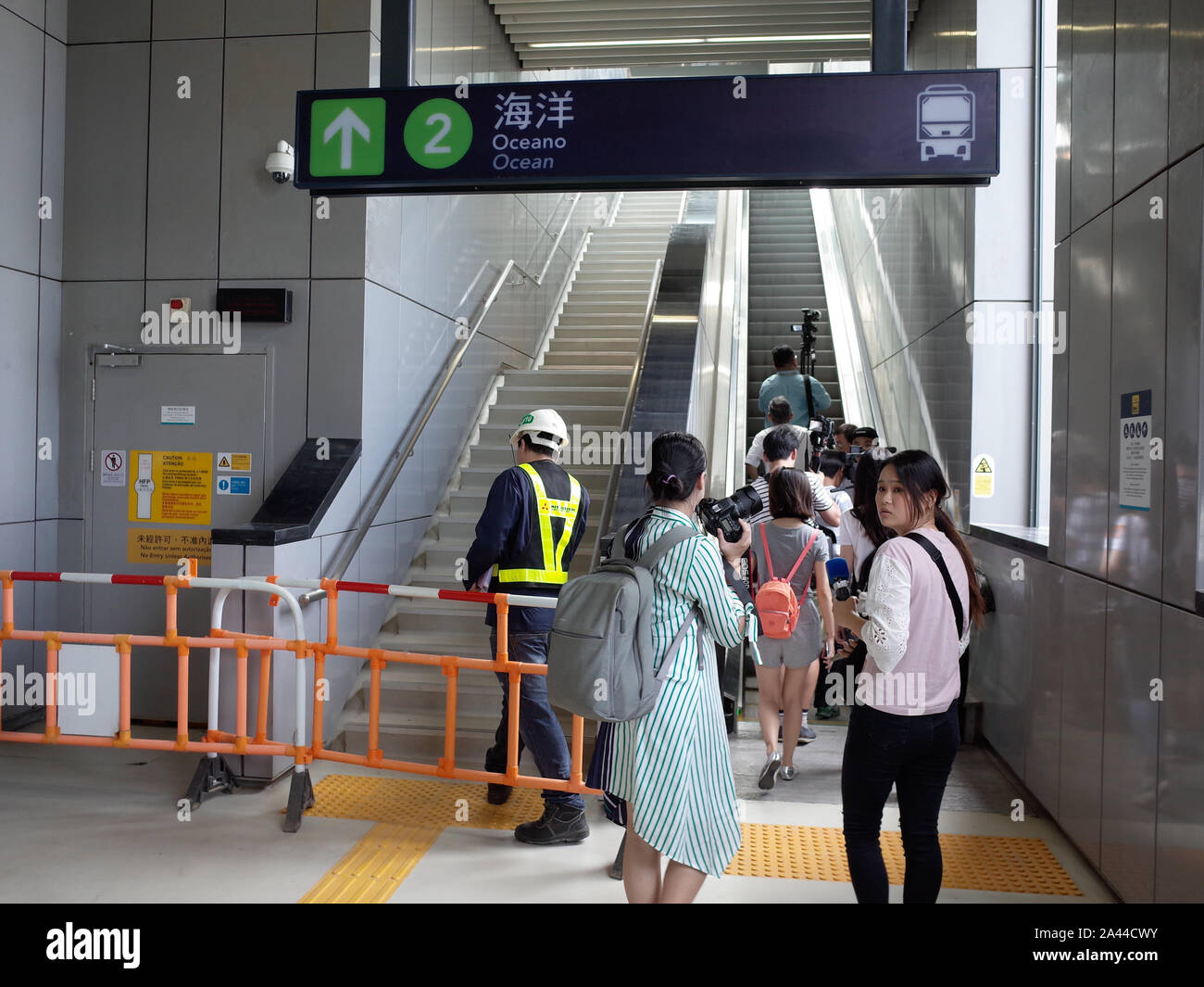 Chinese workers introduce the Light Rail Transit (LRT) system at the ...