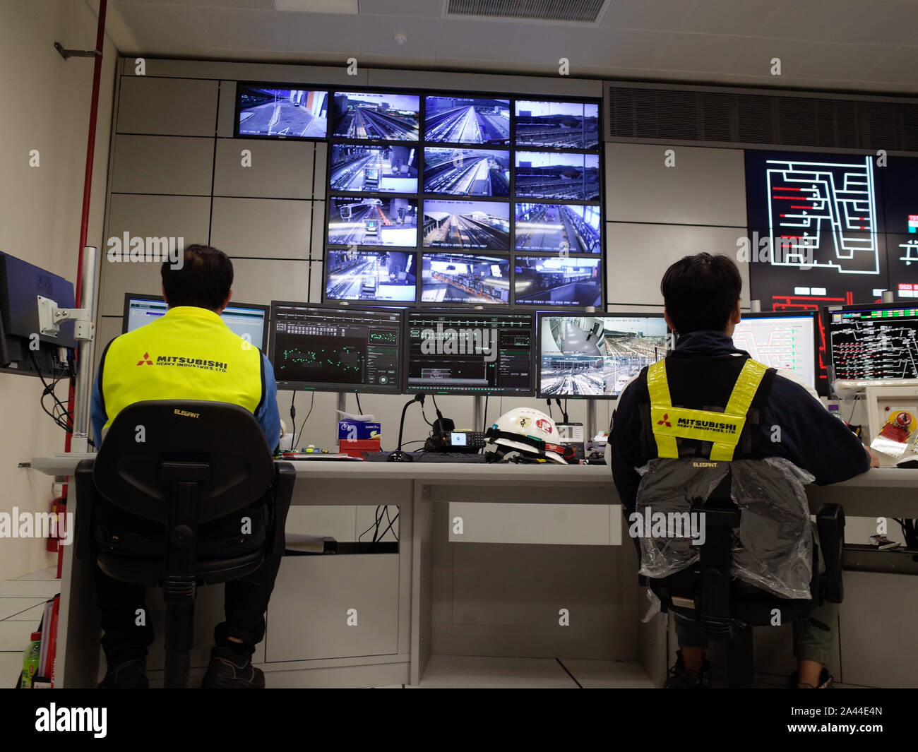 Chinese workers introduce the Light Rail Transit (LRT) system at the ...