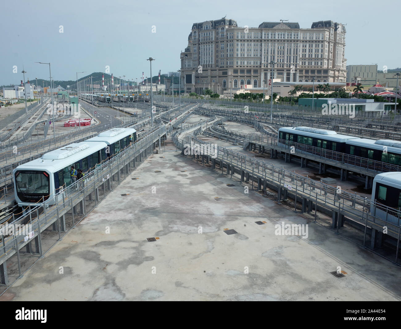 Chinese workers introduce the Light Rail Transit (LRT) system at the ...