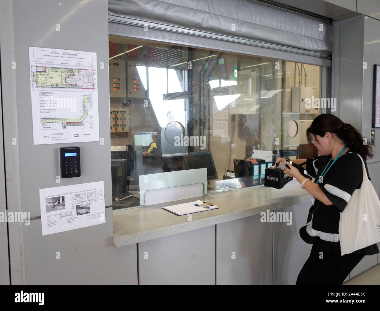 Chinese workers introduce the Light Rail Transit (LRT) system at the ...