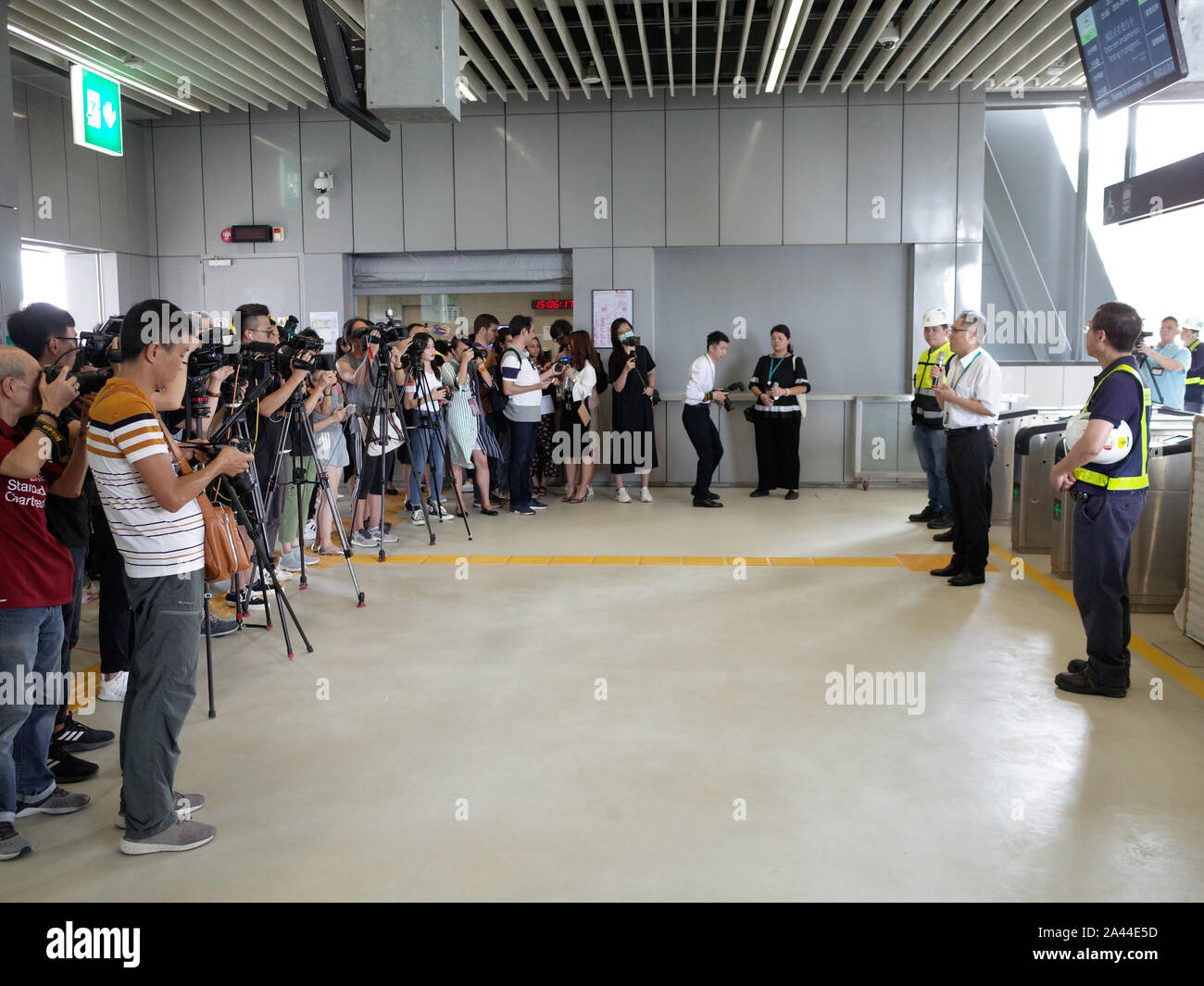Chinese workers introduce the Light Rail Transit (LRT) system at the ...