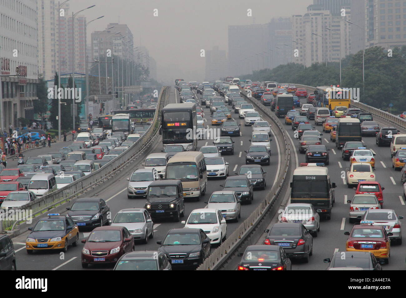 --FILE--Masses of vehicles move slowly on a road in a traffic jam ...