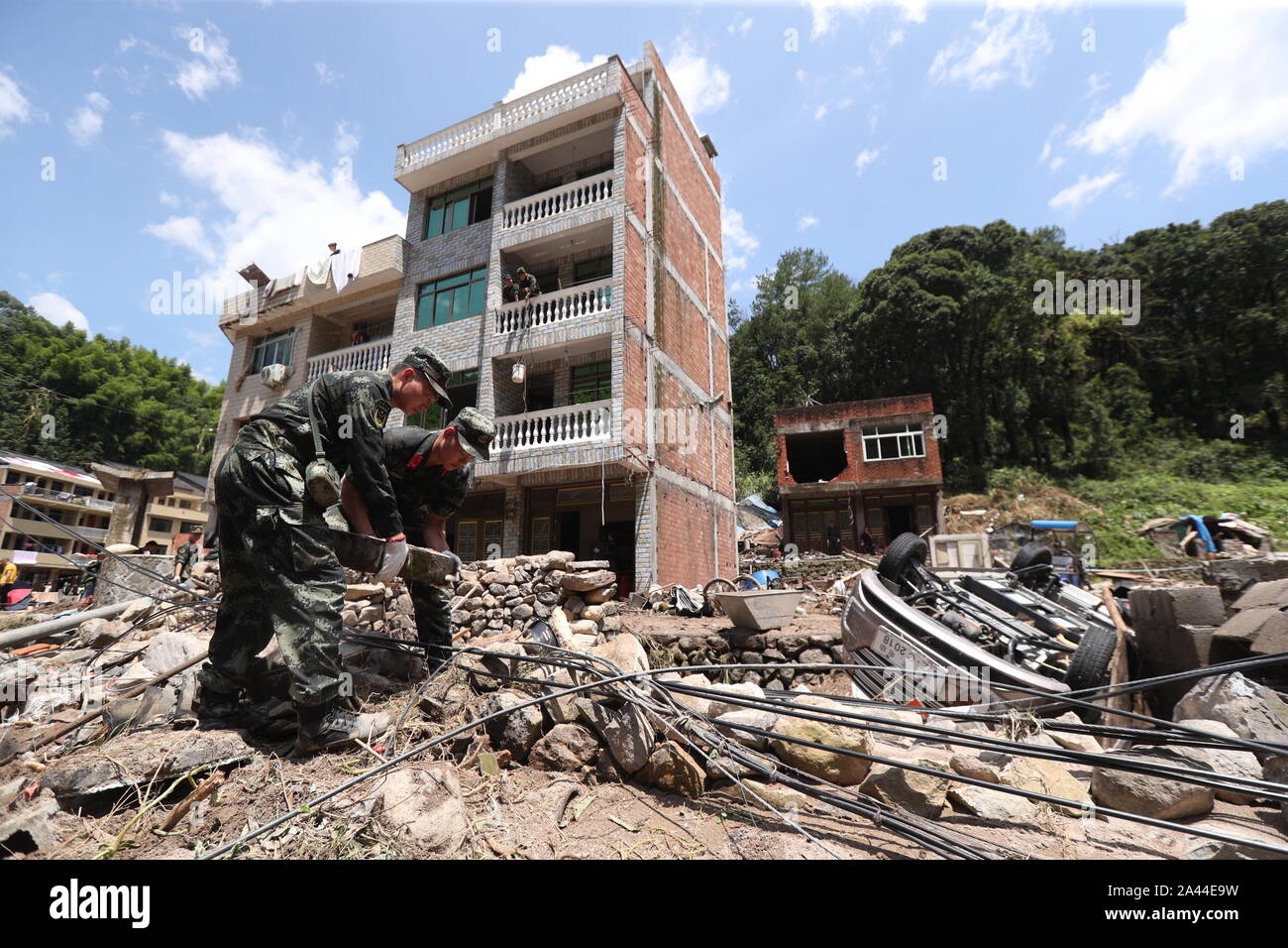 Rescuers conduct rescue operation in landslide area caused by Typhoon ...