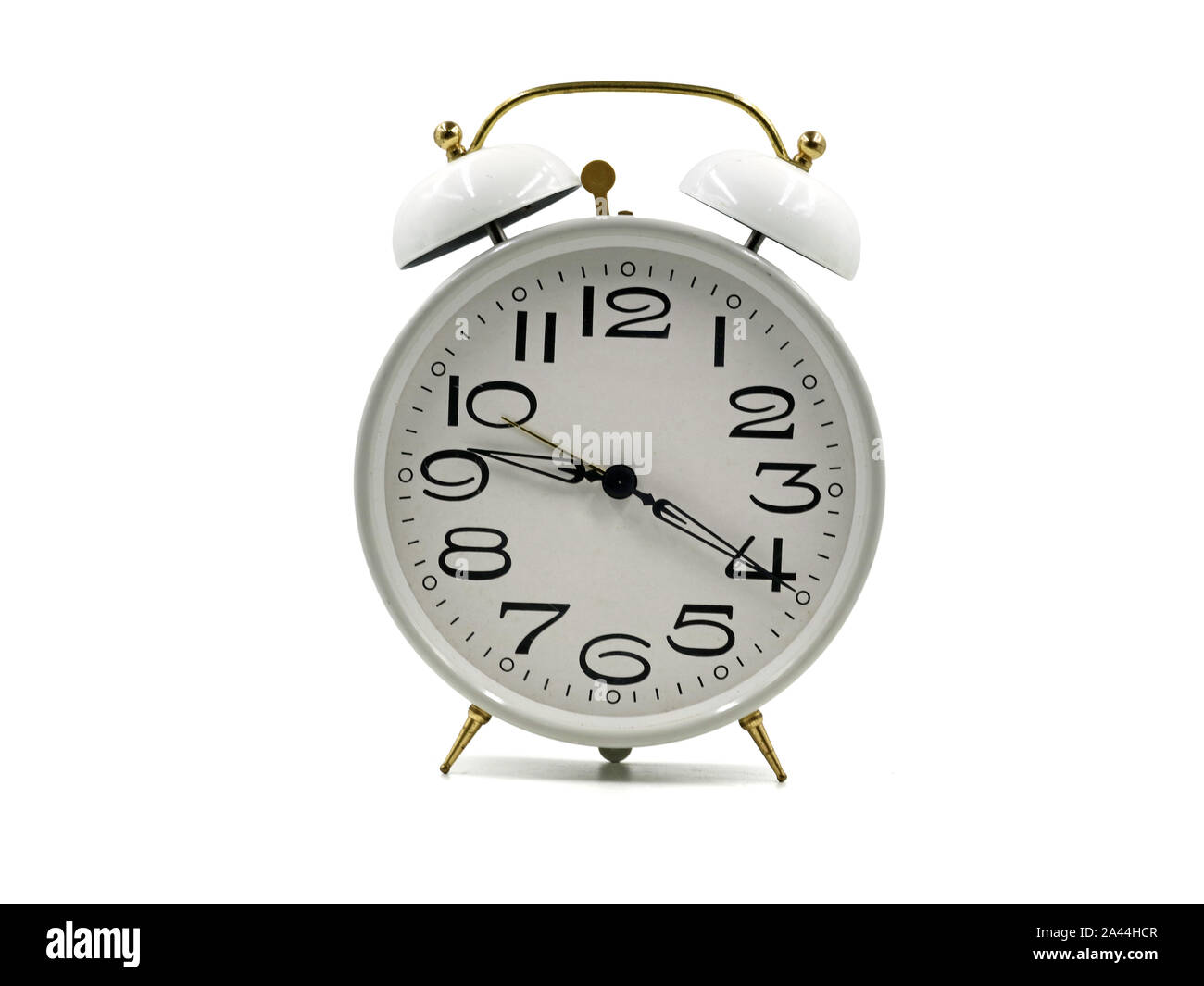 white alarm clock isolated on white background Stock Photo - Alamy
