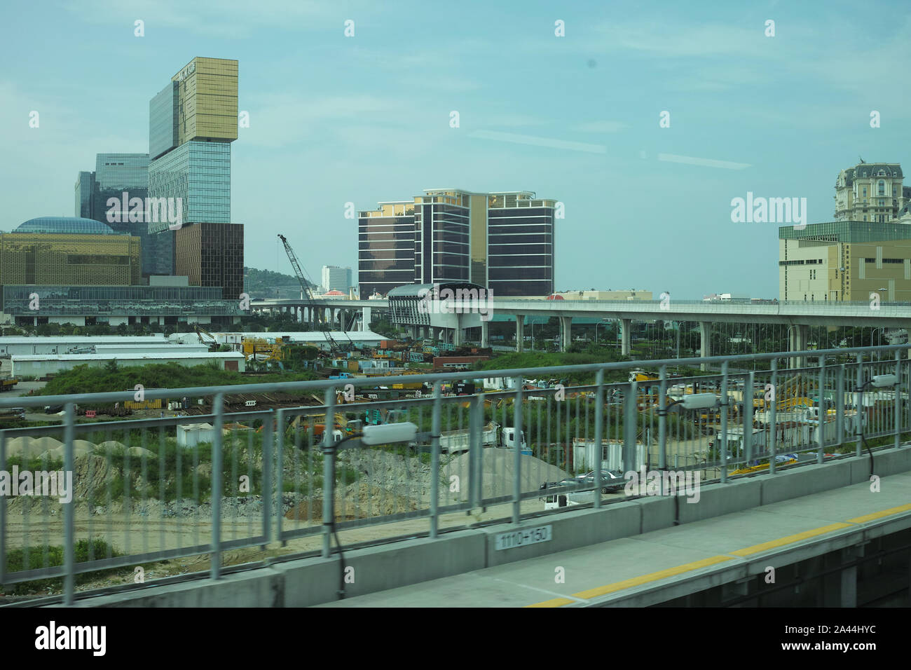 Chinese workers introduce the Light Rail Transit (LRT) system at the ...