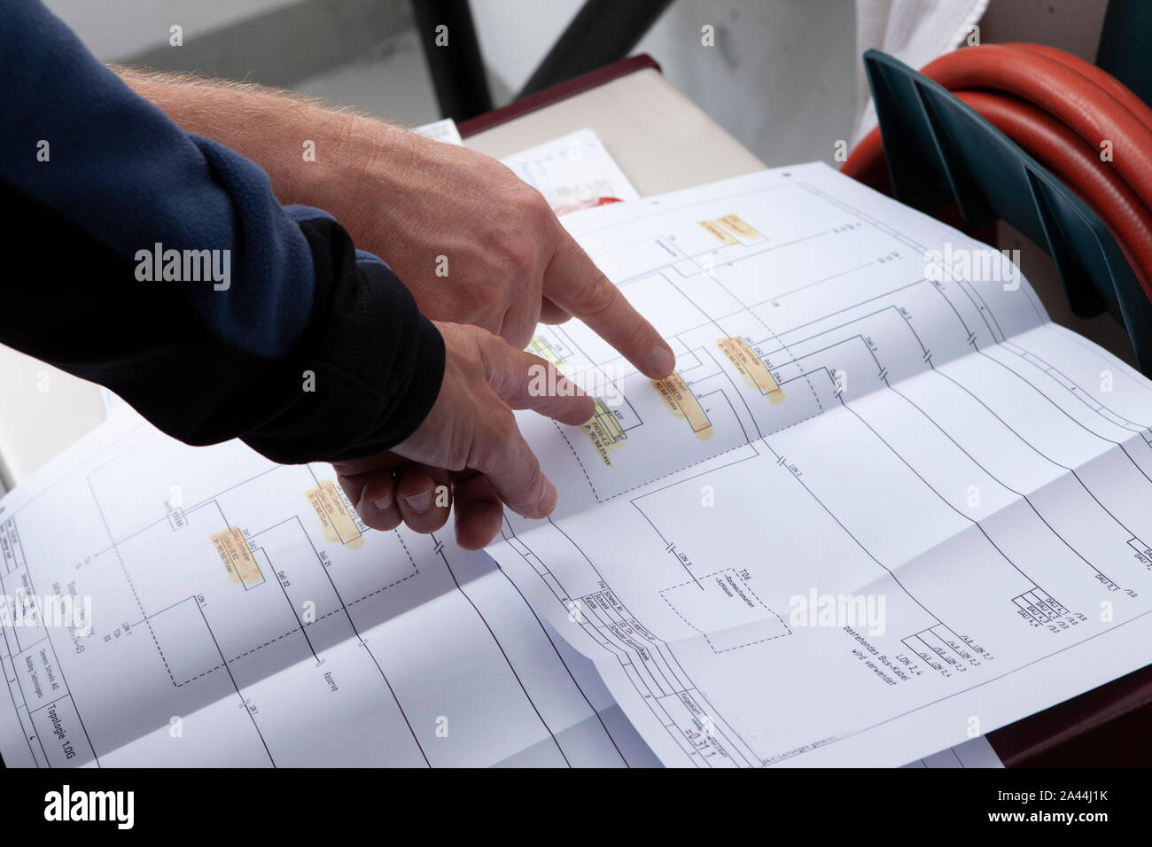 workmen and engineer working an planing on the job showing hands Stock ...