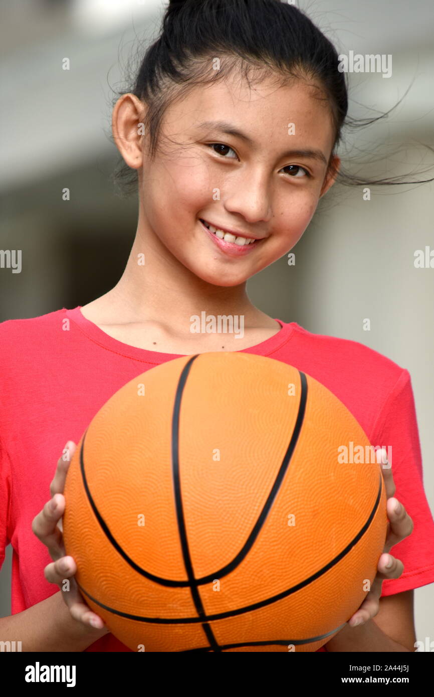 Asian Female Basketball Player And Happiness With Basketball Stock ...