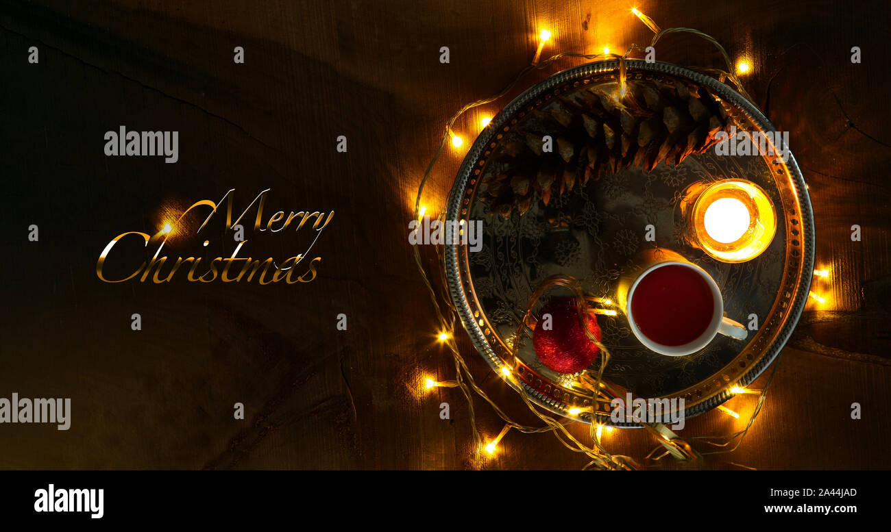 christmas theme with candles, snow, pinecone and christmas light with ...