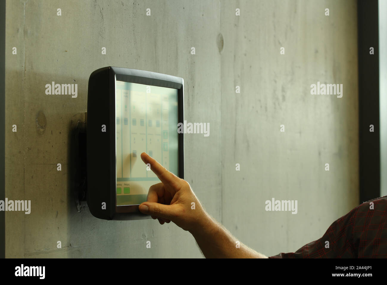 hand and arm controlling a room with a computer pad Stock Photo - Alamy