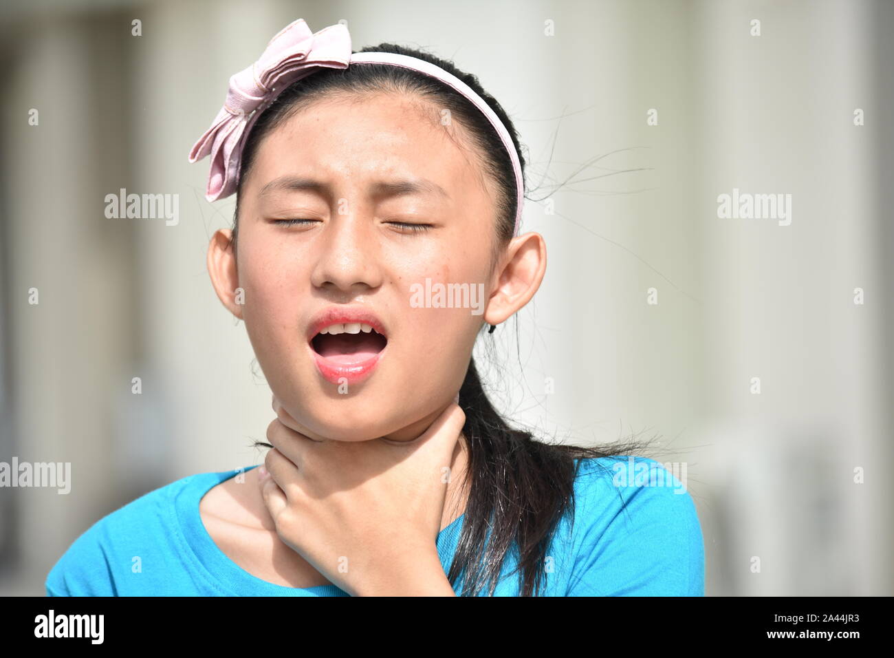 Youthful Minority Girl Choking Stock Photo - Alamy