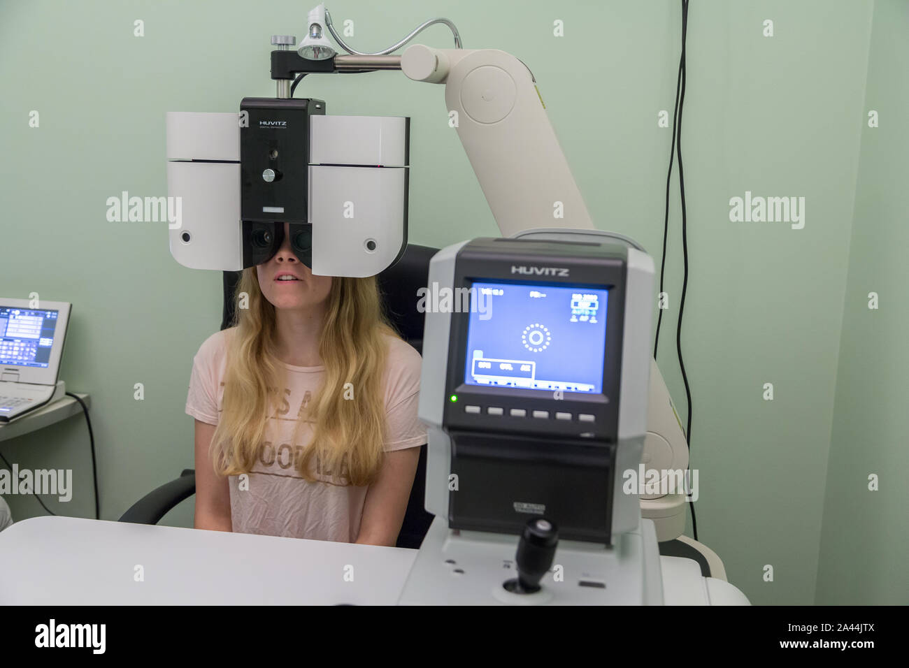 Young woman at eyesight inspection at optician Stock Photo - Alamy