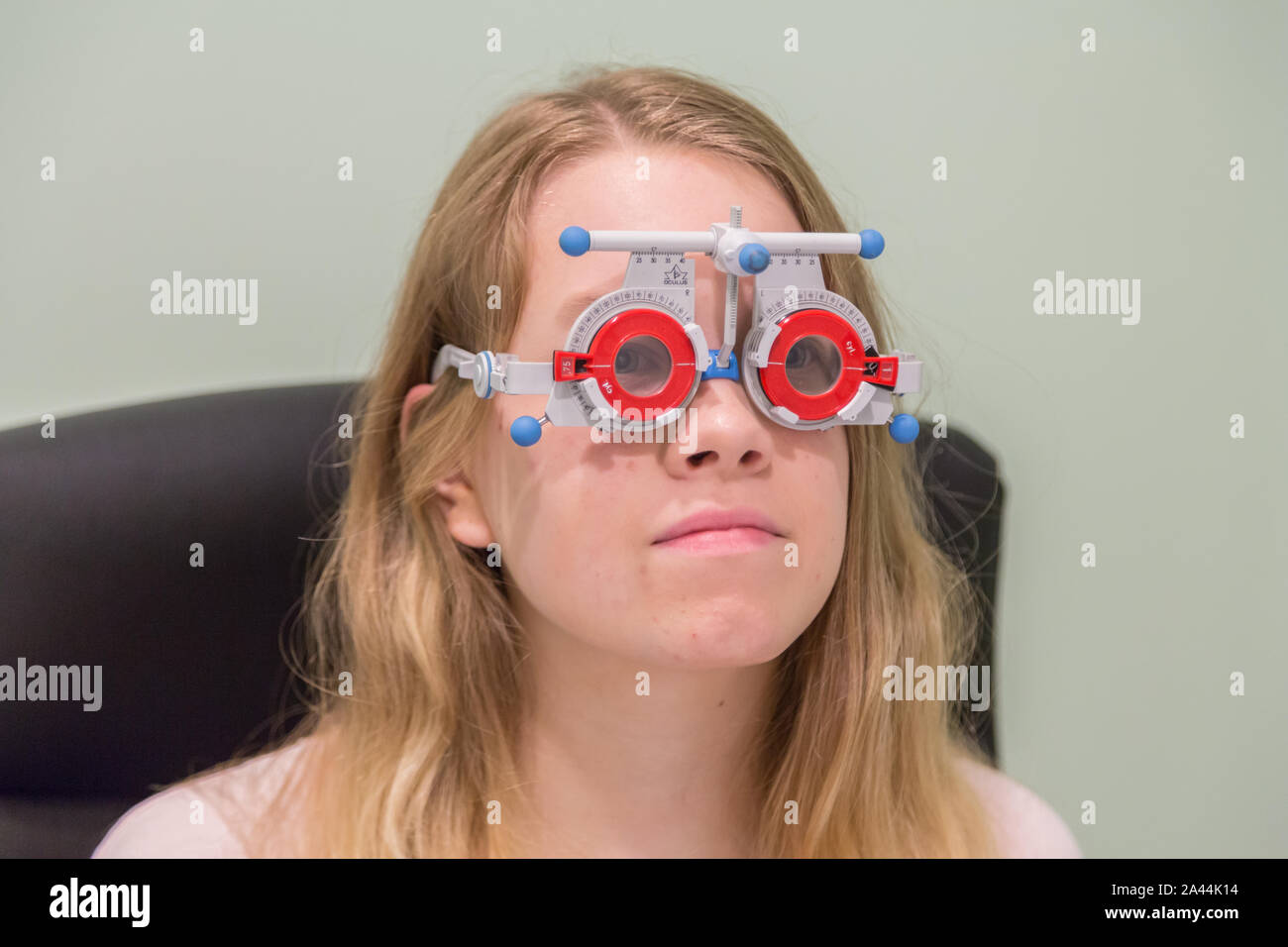 Young woman at eyesight inspection at optician Stock Photo - Alamy