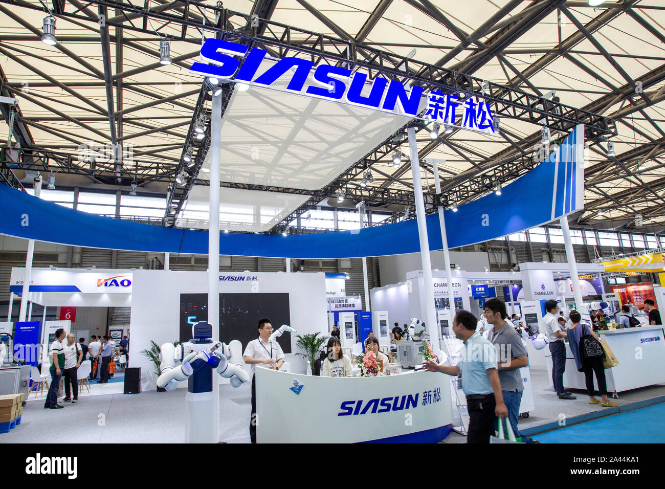 --FILE--People visit the stand of Siasun Robot & Automation Co during ...