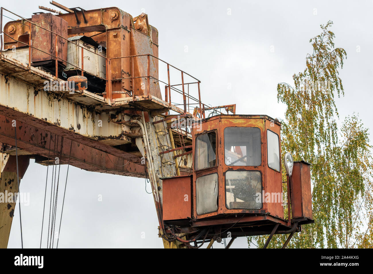 Old rusty lifting crane stands outdoors Stock Photo - Alamy