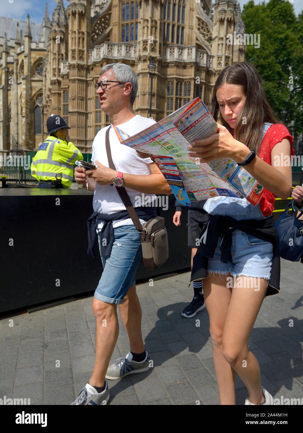 London, England, UK. Tourists in Westminster looking at a map Stock ...
