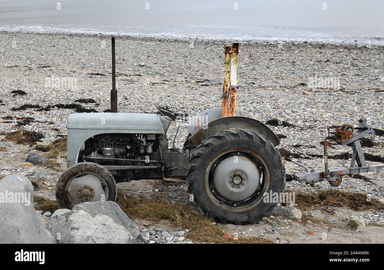 Tractor on beach Stock Photo - Alamy