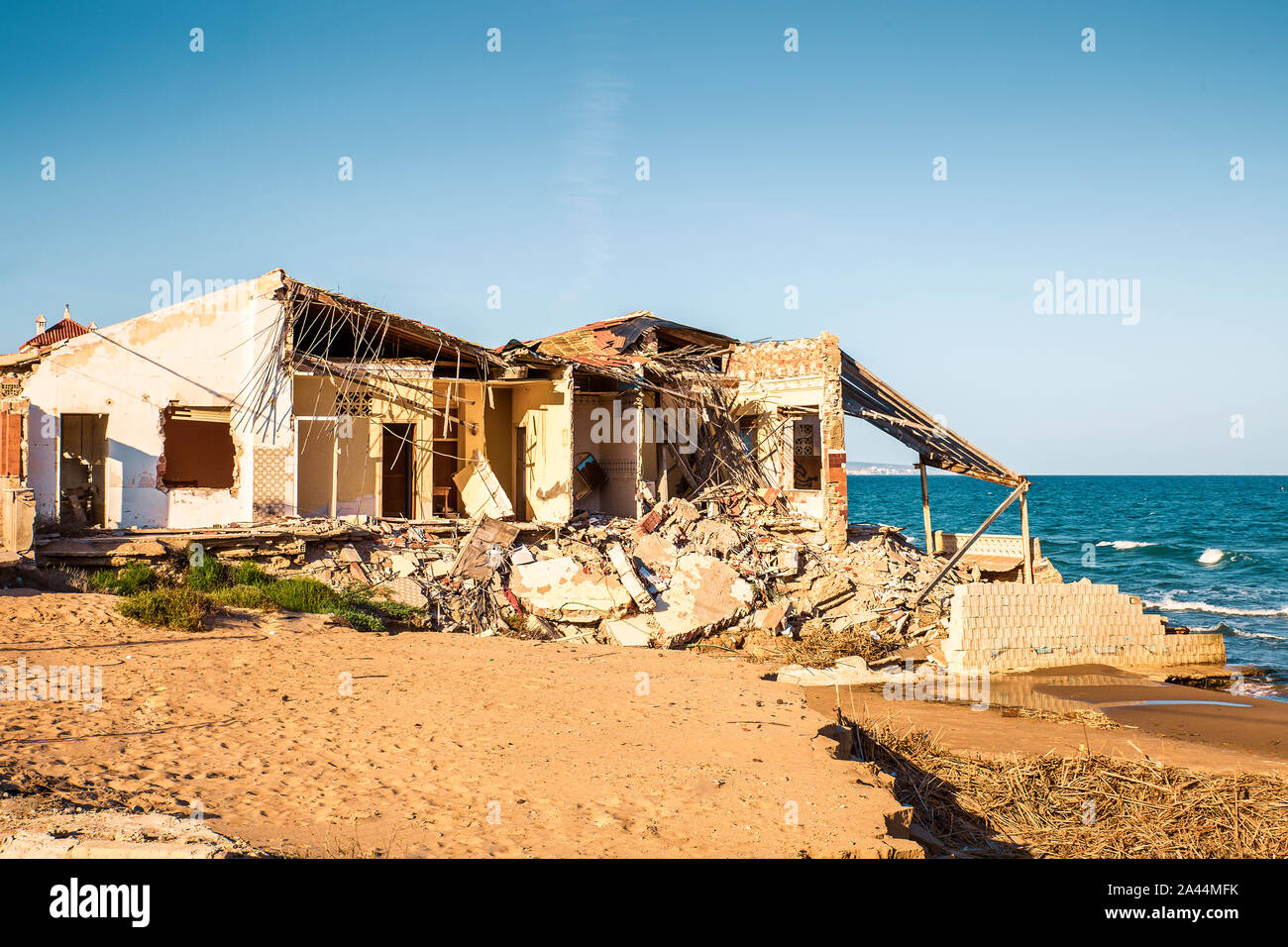 Building destroyed after storm in the beach by climate change Stock ...
