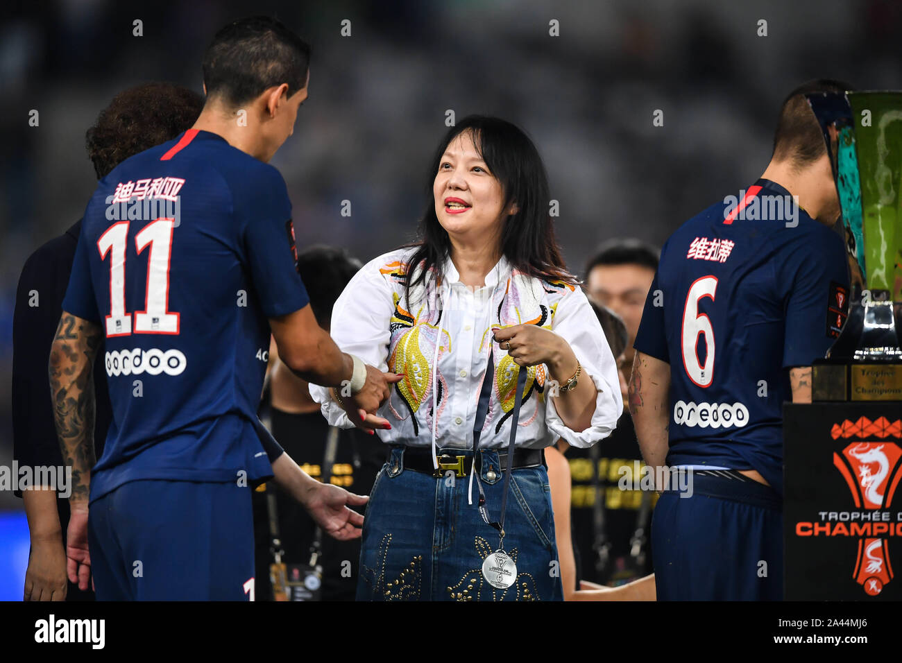 Angel Di Maria of Paris Saint-Germain shakes hands with a Chinese ...