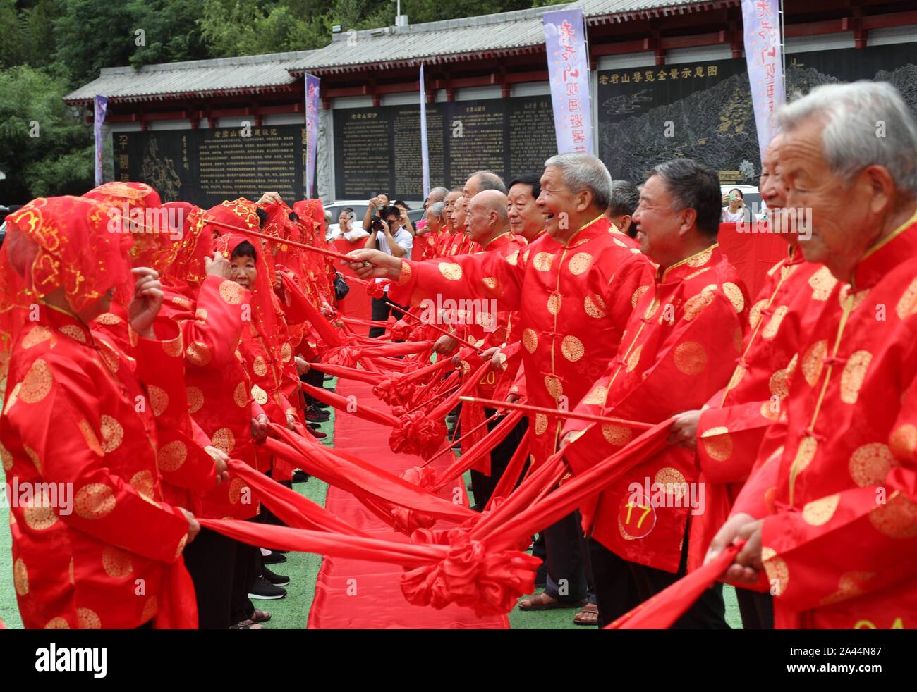 Chinese elderly couples take part in a group wedding ceremony to ...