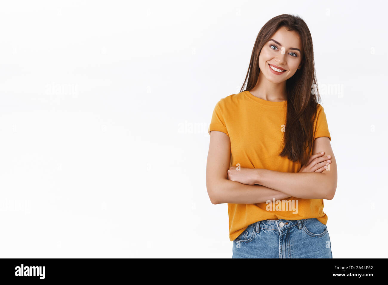 Attractive woman in yellow t-shirt cross hands over chest with self ...