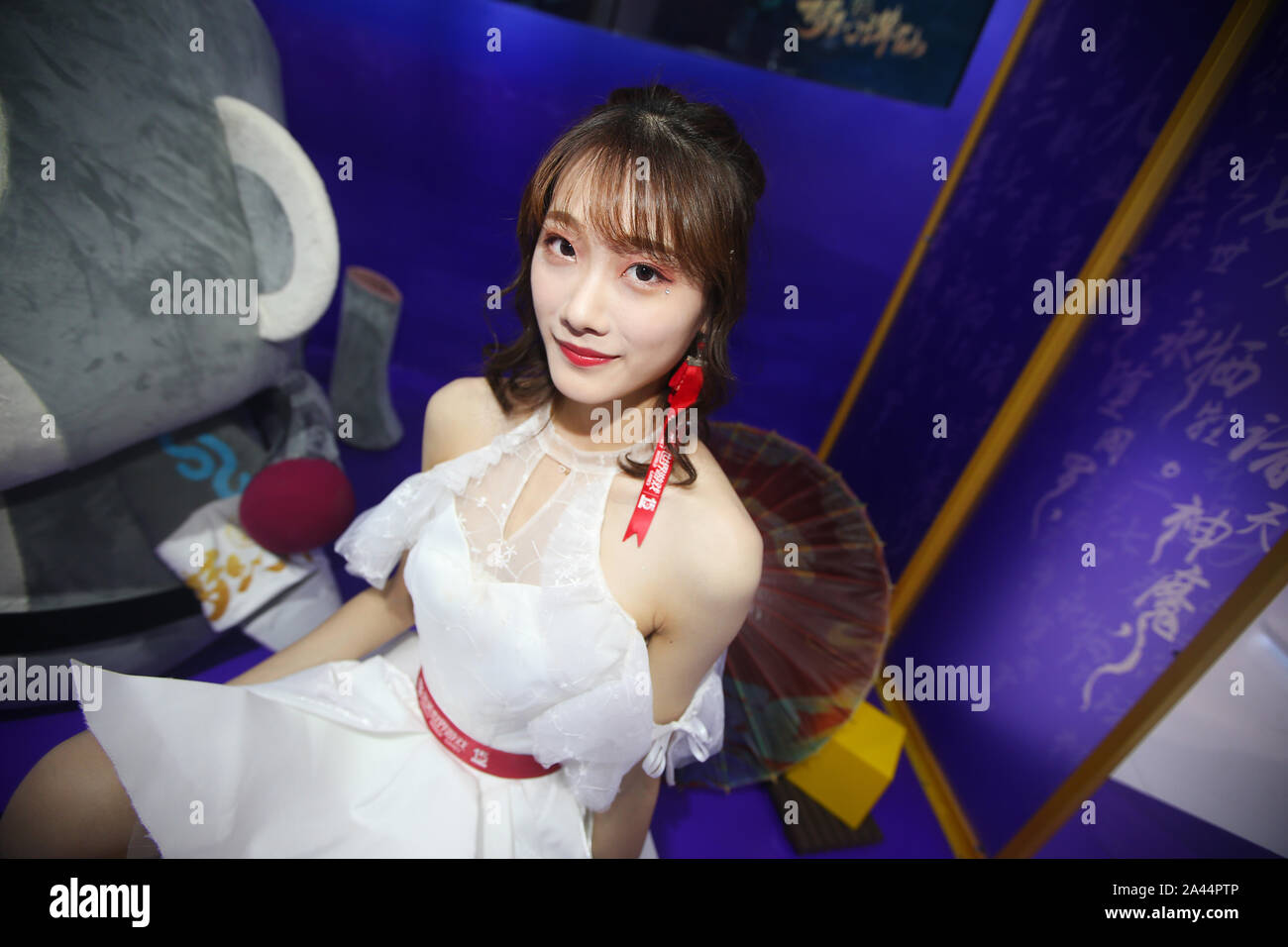 A Chinese showgirl poses during the 17th China Digital Entertainment Expo, also known as ...