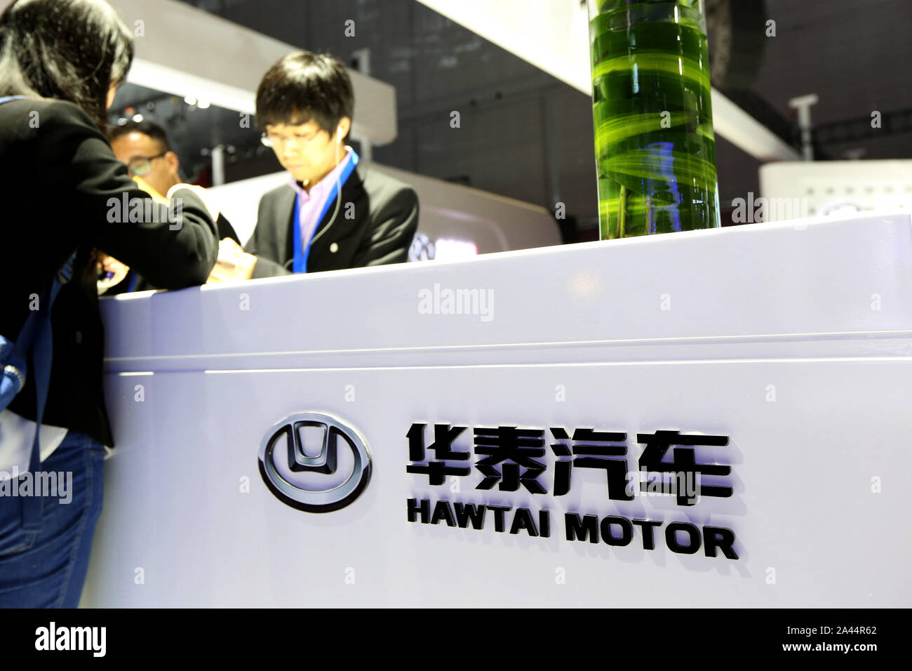 --FILE--People visit the stand of Hawtai Motor during the 16th Shanghai ...