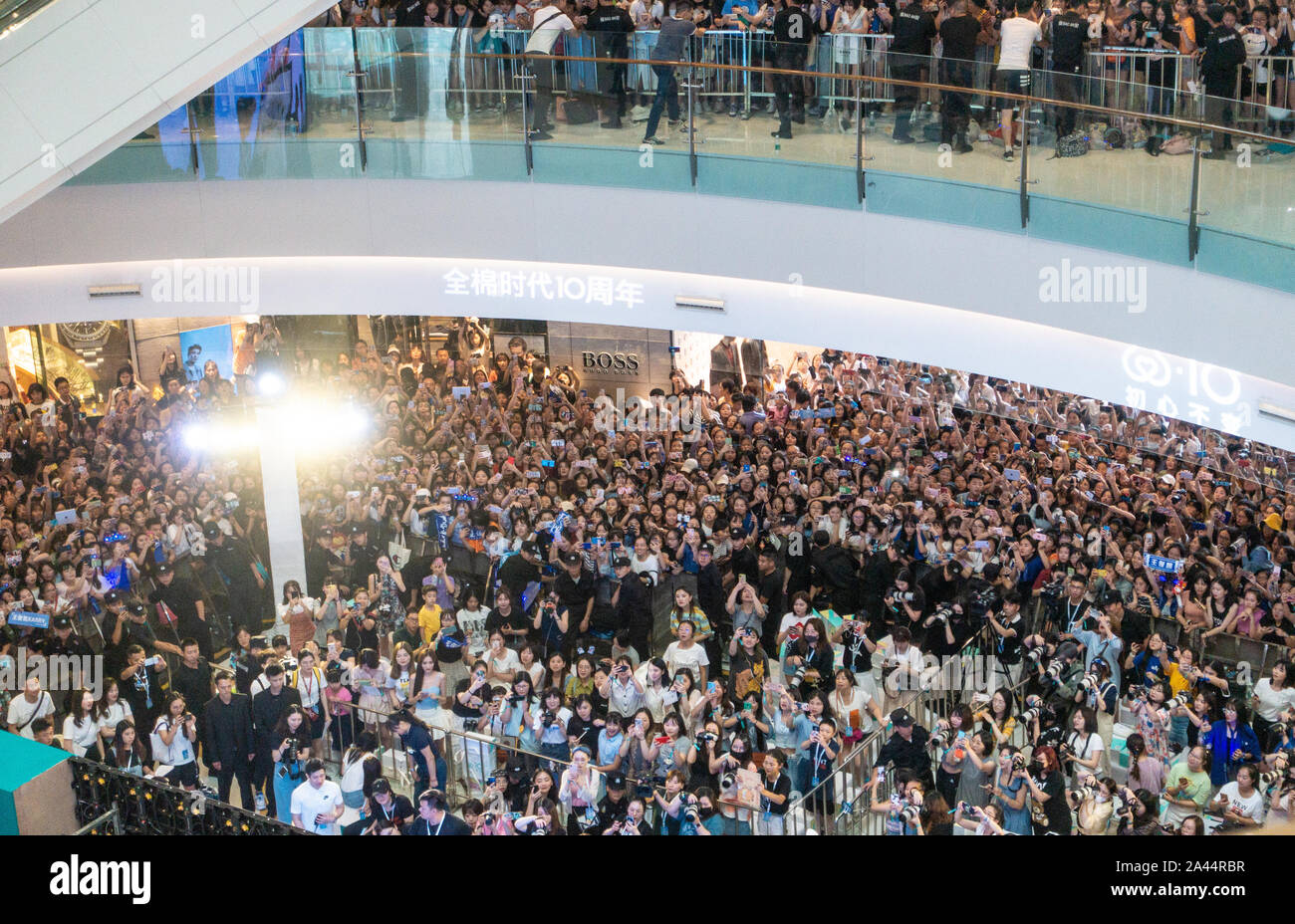 Chinese fans crowd a shopping mall to support singer and actor Karry ...