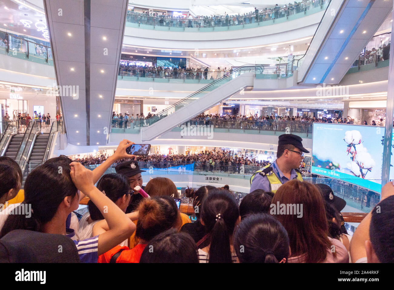 Chinese fans crowd a shopping mall to support singer and actor Karry ...