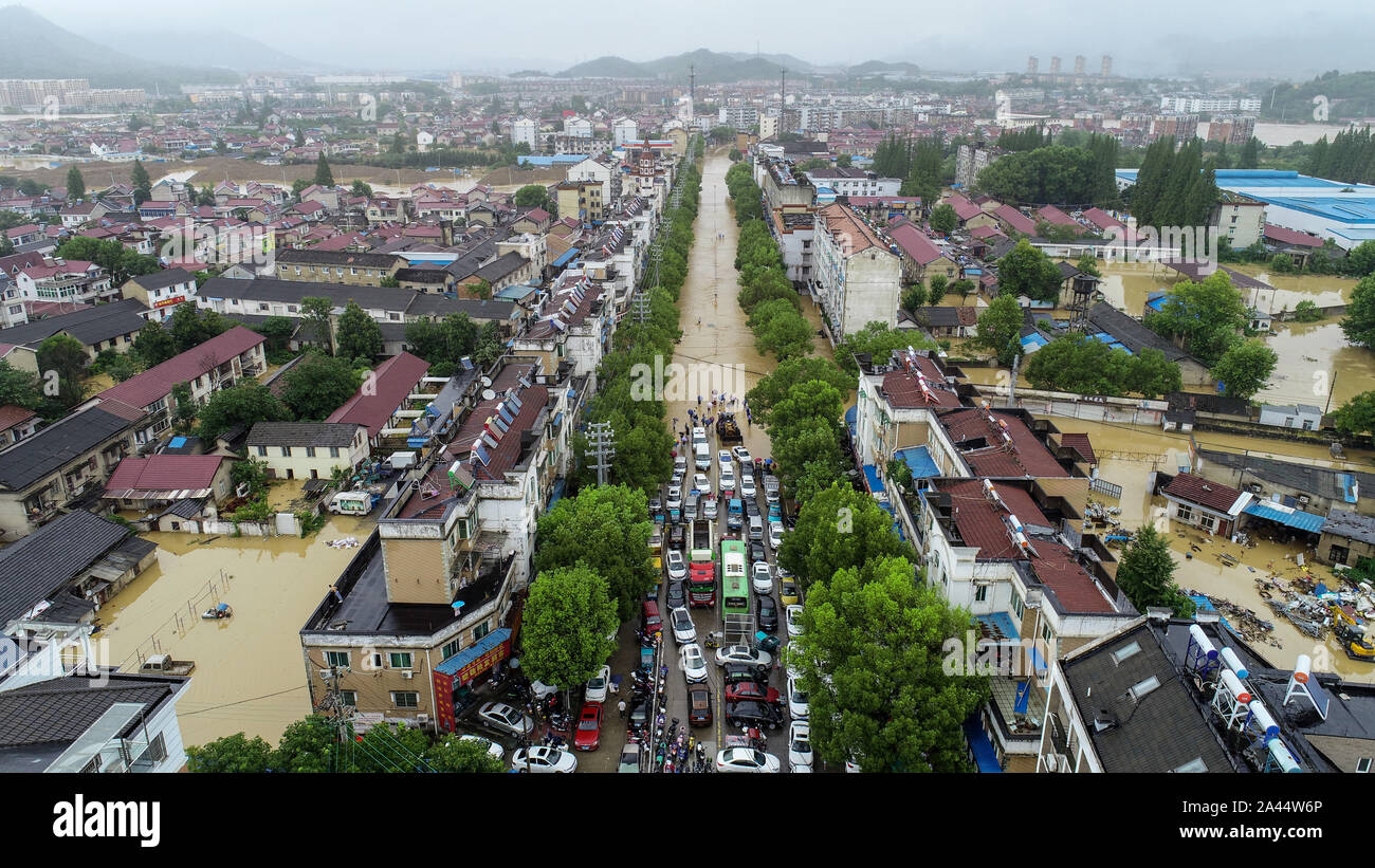 Aerial view of residential buildings and fields submerged by floodwater ...