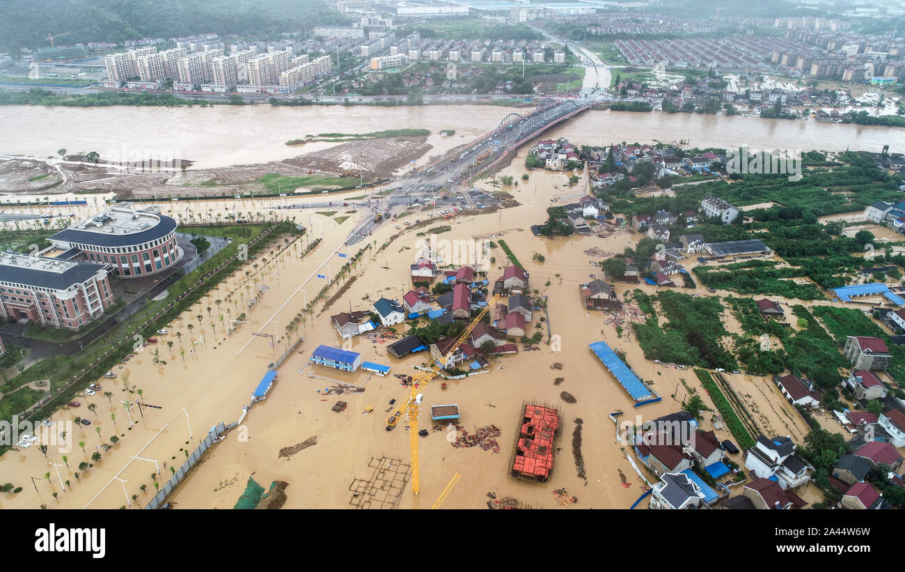 Aerial view of residential buildings and fields submerged by floodwater ...