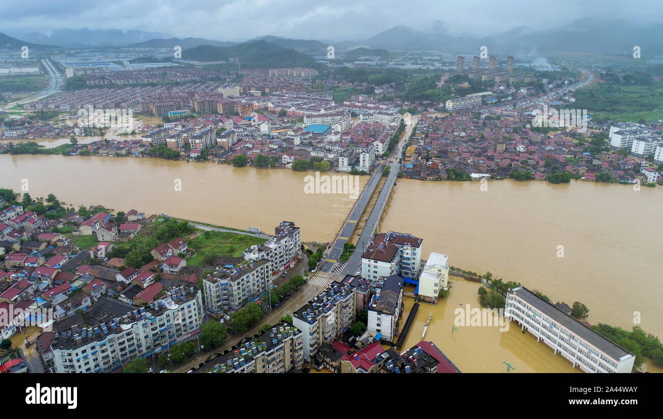 Aerial view of residential buildings and fields submerged by floodwater ...