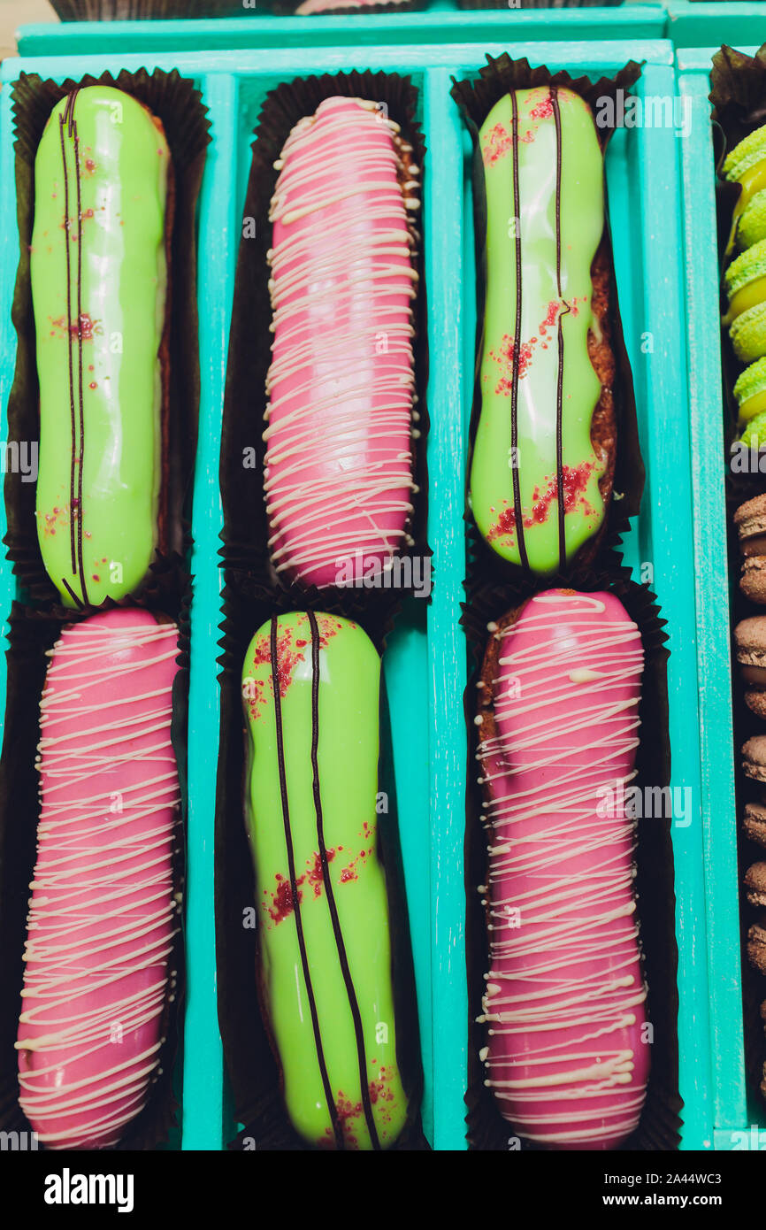 blue gift box with eclairs and macaroon Stock Photo - Alamy