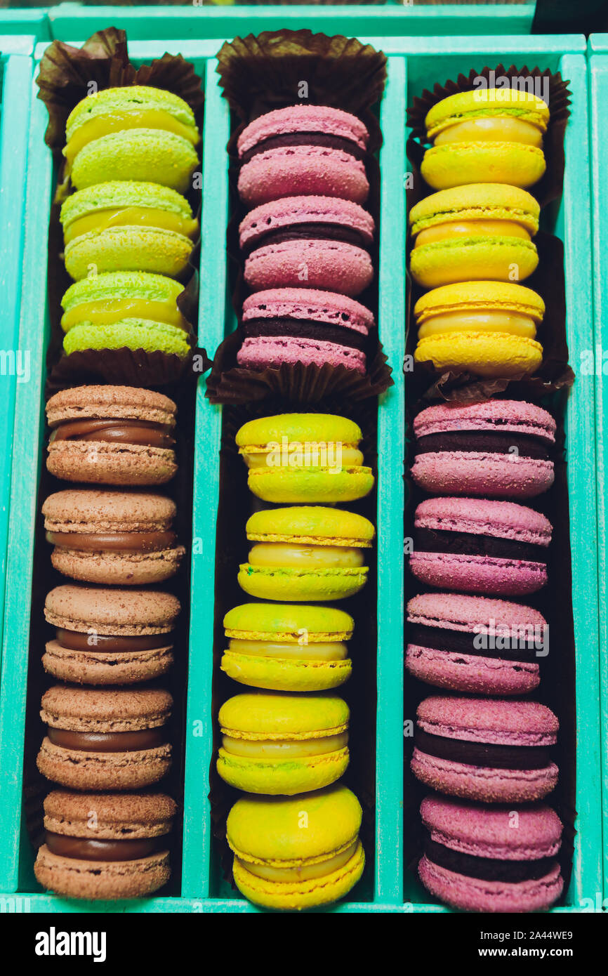 blue gift box with eclairs and macaroon Stock Photo - Alamy