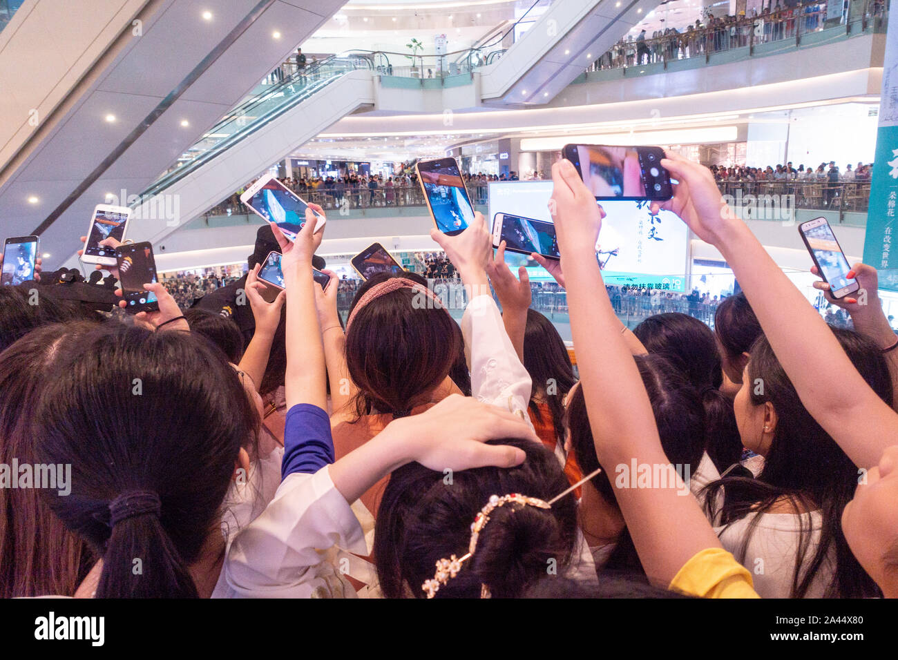 Chinese fans crowd a shopping mall to support singer and actor Karry ...