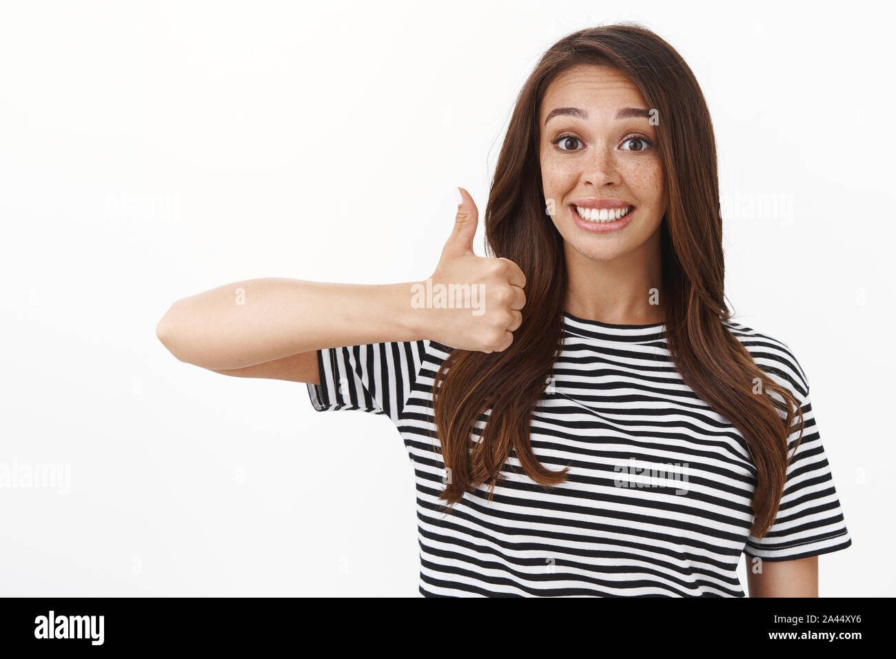 Friendly supportive young girl smiling happily, approve good choice ...