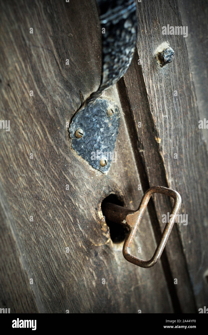 vintage oak church door with old key Stock Photo - Alamy