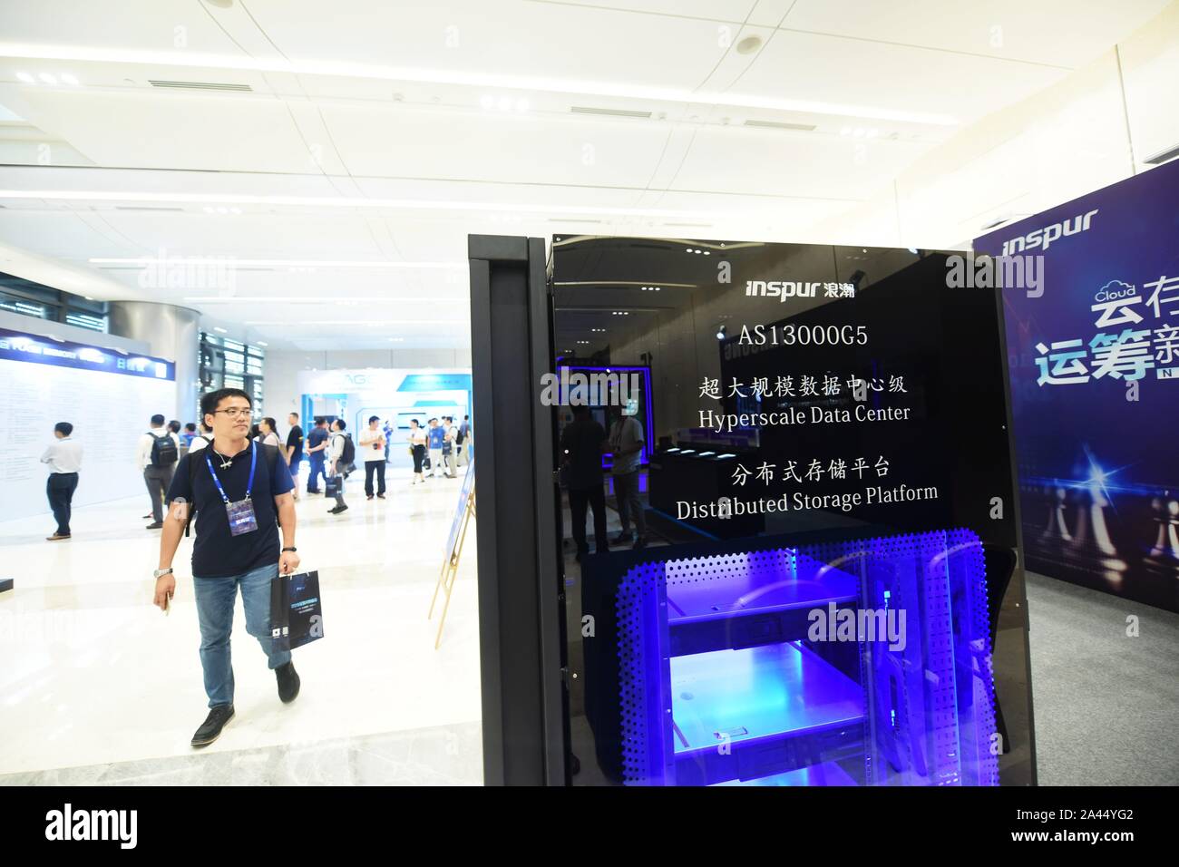 Visitors have a look of exhibited products at Flash Memory World in ...