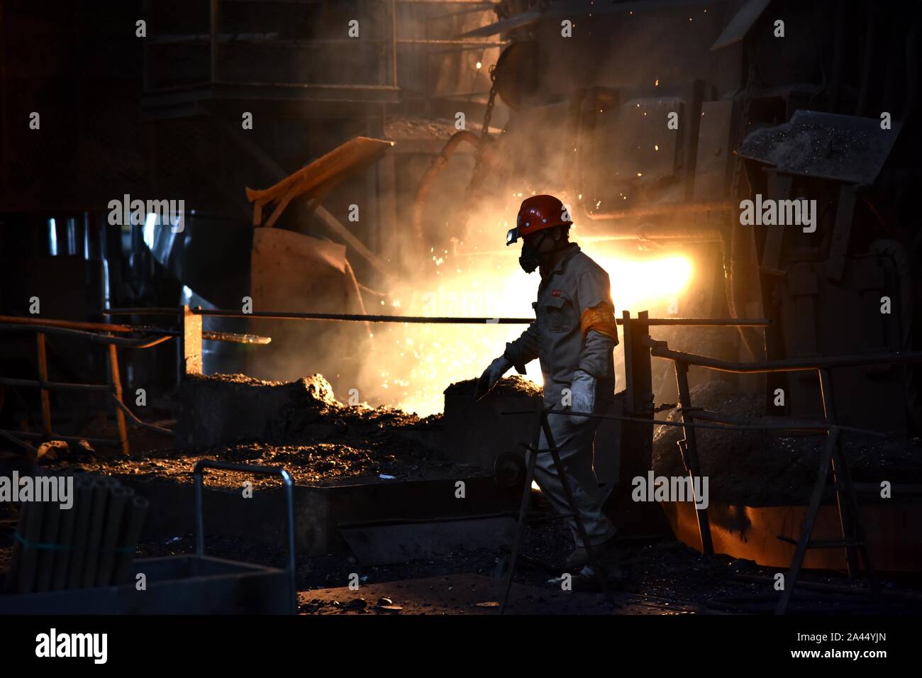 --FILE--A Chinese worker processes steel parts at the plant of Shandong ...