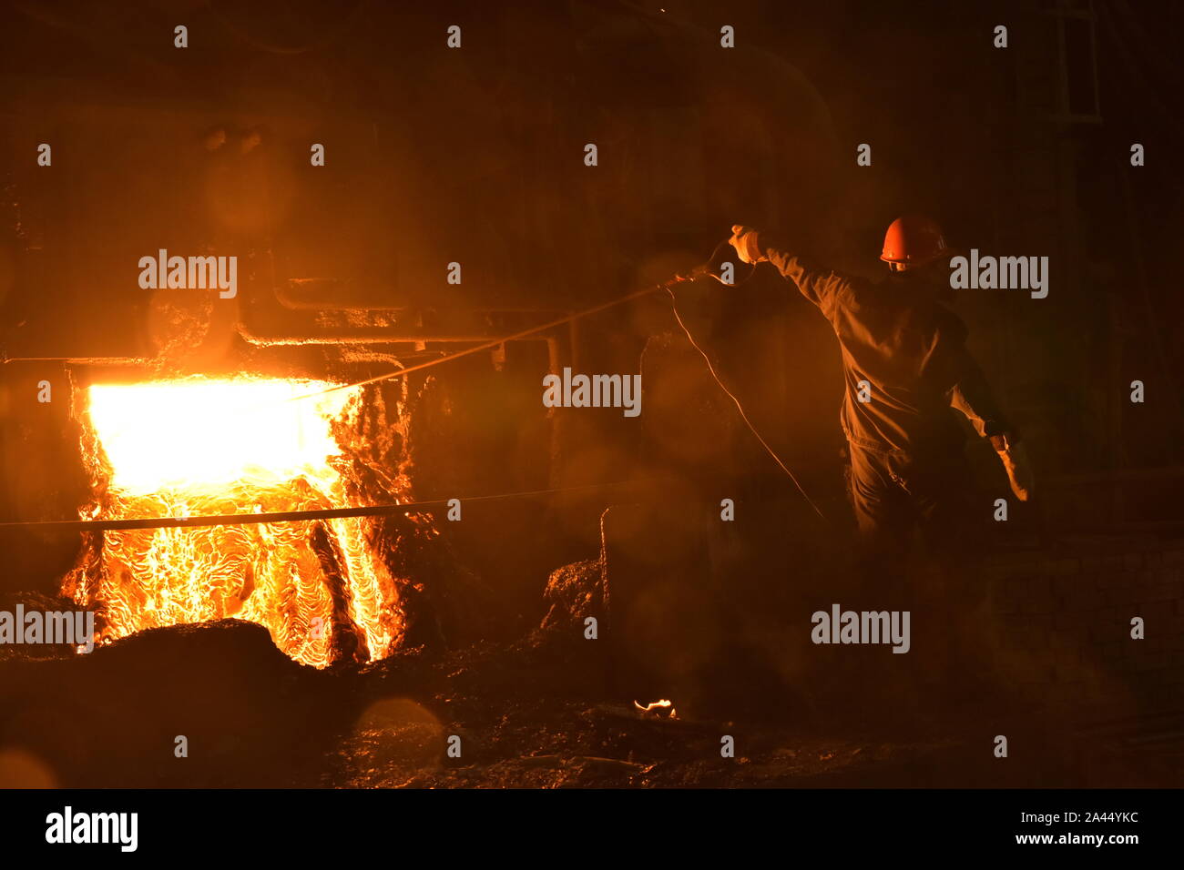 --FILE--A Chinese worker processes steel parts at the plant of Shandong ...