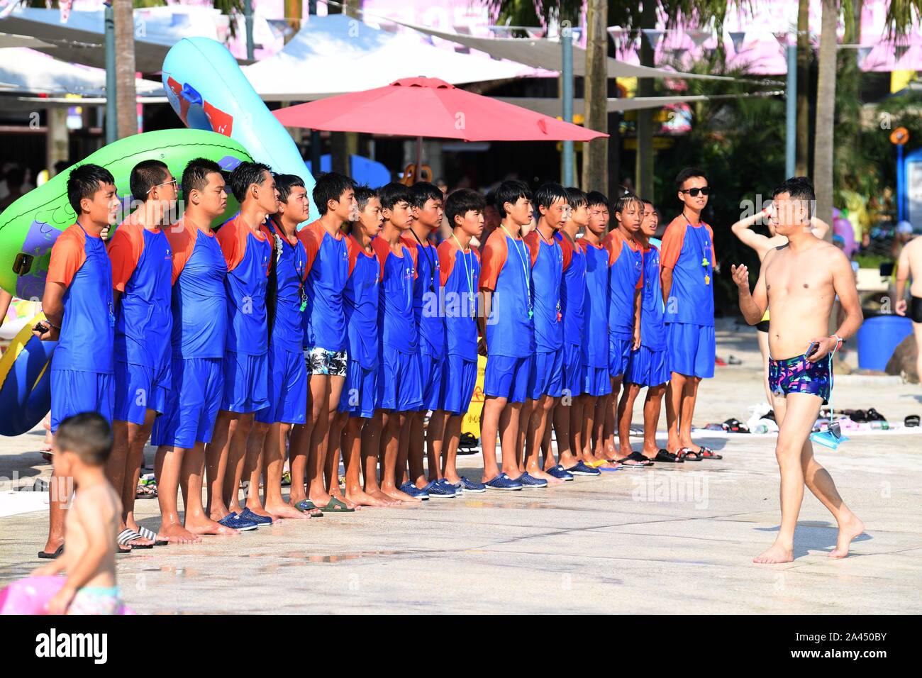 Chinese holidaymakers crowd a swimming pool at a water park to escape ...