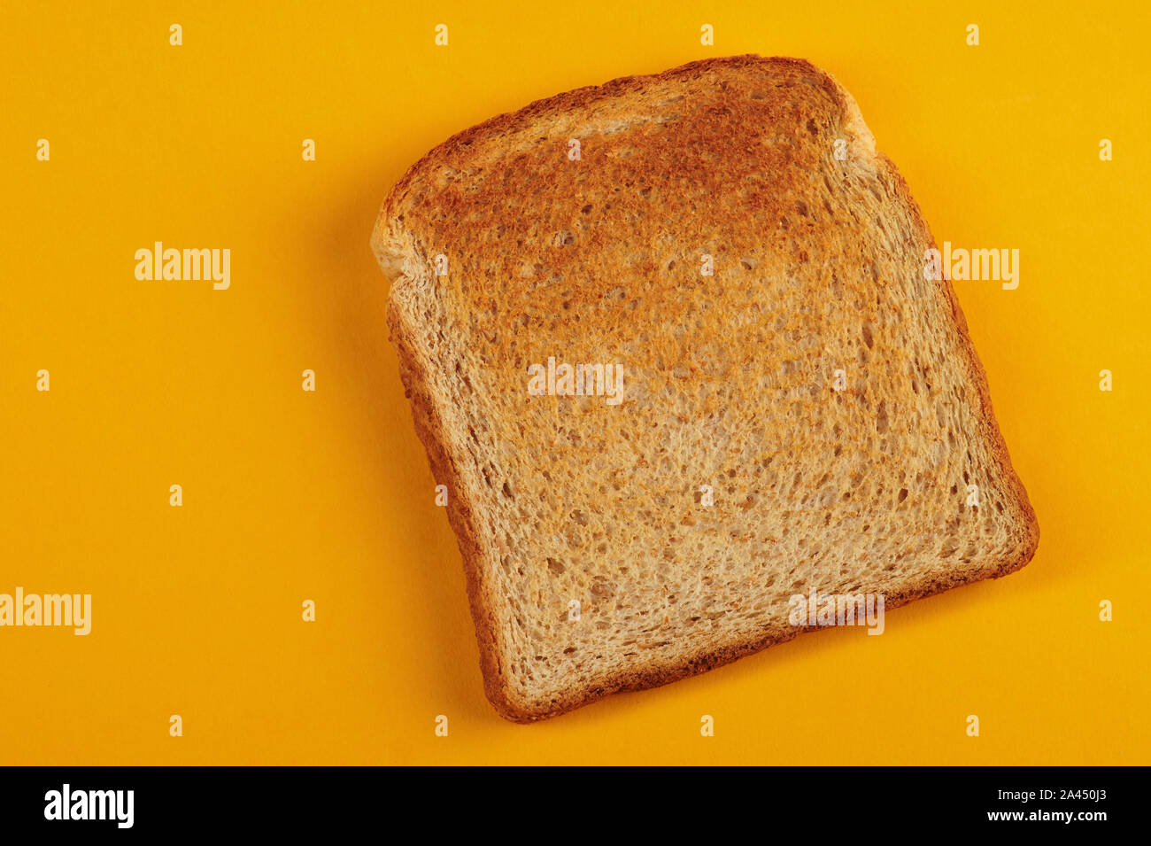One bread toast close up view isolated on yellow background Stock Photo ...