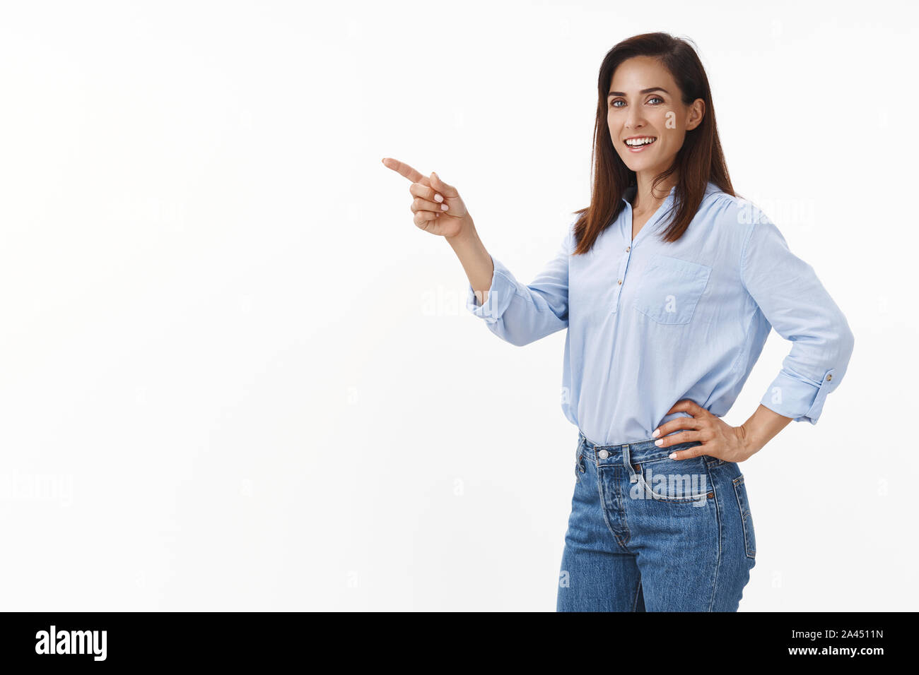 Confident good-looking motivated businesswoman stand half-turned office ...