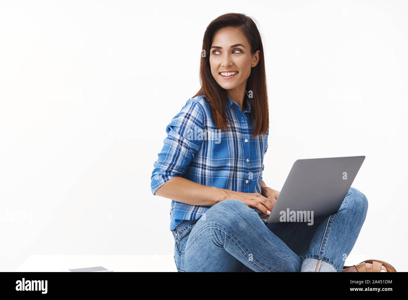 Good-looking ambitious female entrepreneur computer programmer writing ...