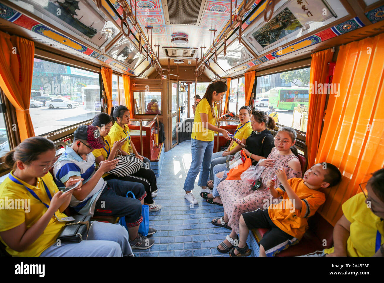 Passengers experience the old-fashioned bus in Xi’an city, northwest ...