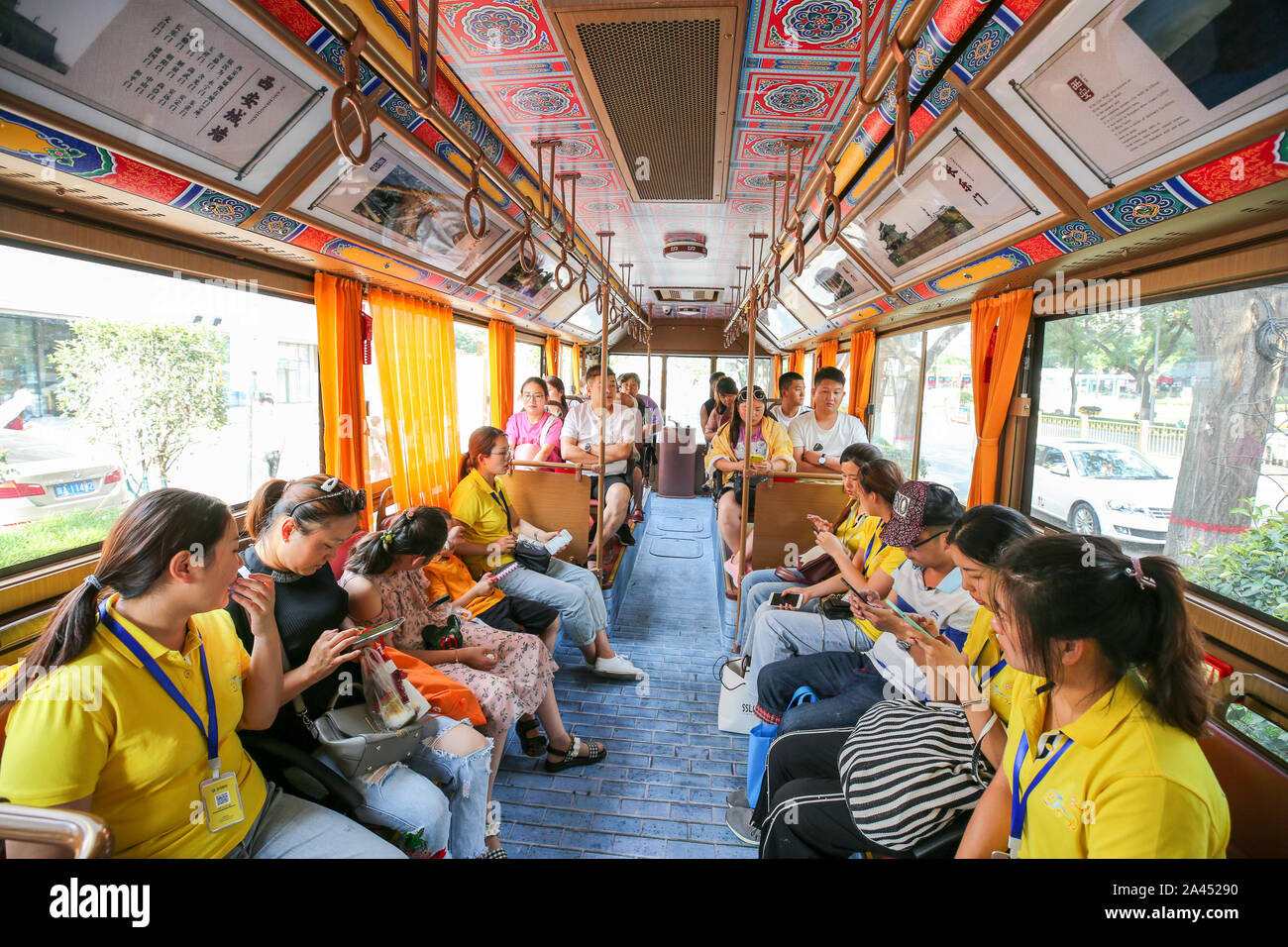 Passengers experience the old-fashioned bus in Xi’an city, northwest ...