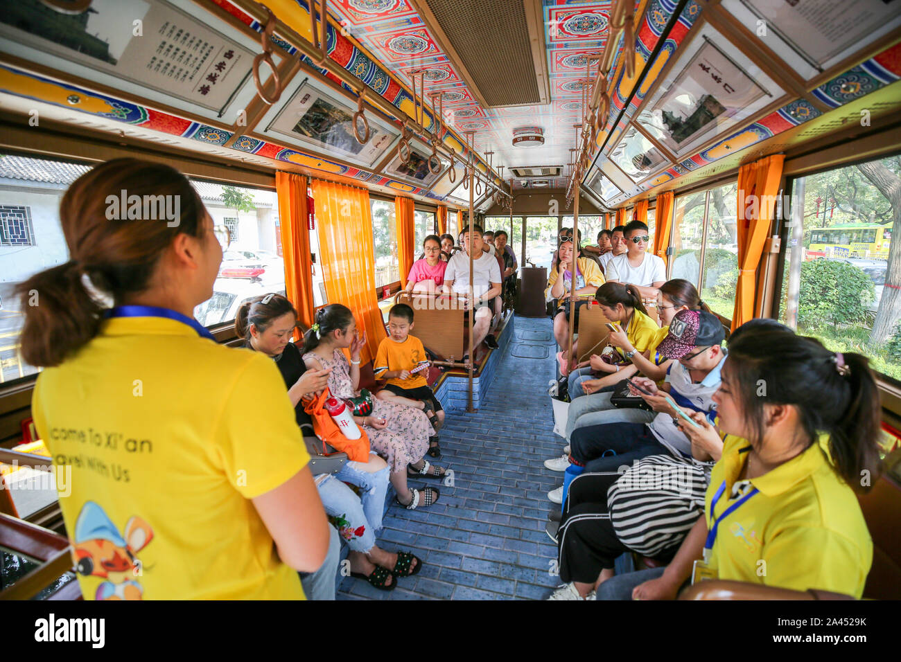 Passengers experience the old-fashioned bus in Xi’an city, northwest ...