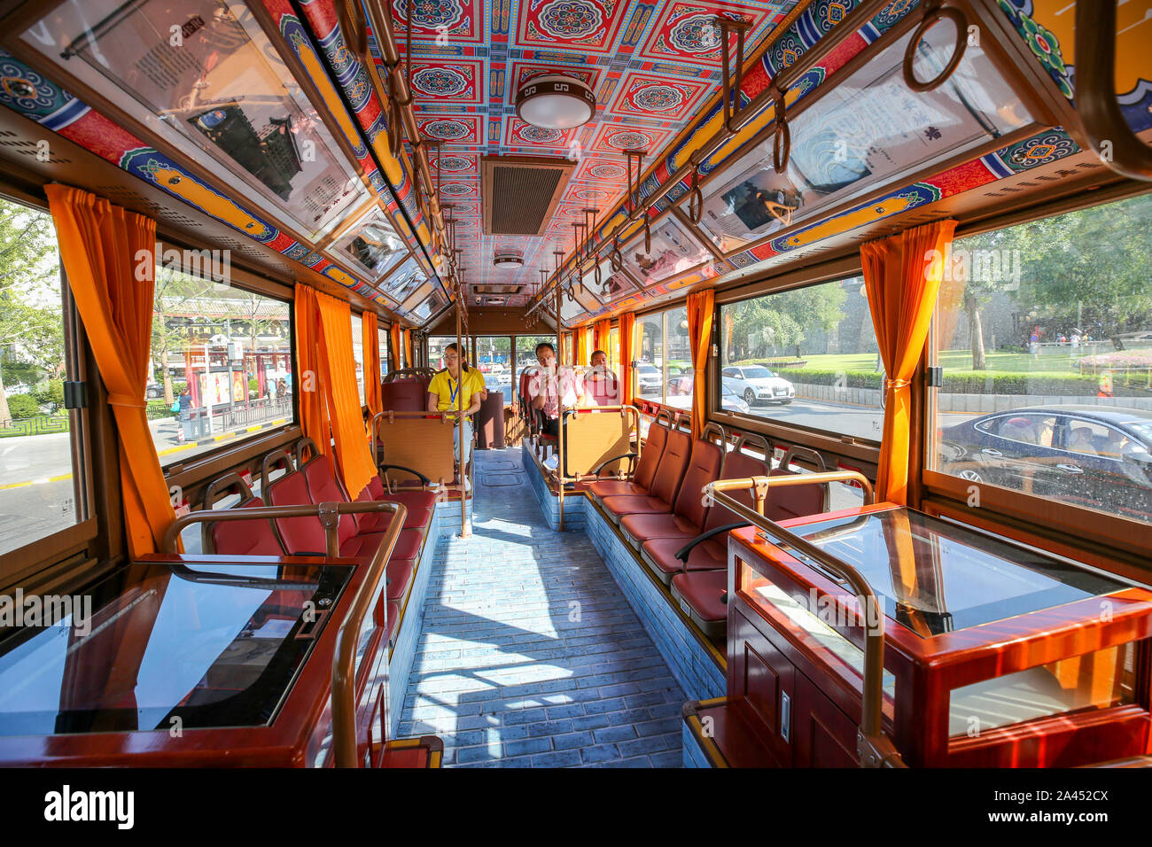 Passengers experience the old-fashioned bus in Xi’an city, northwest ...