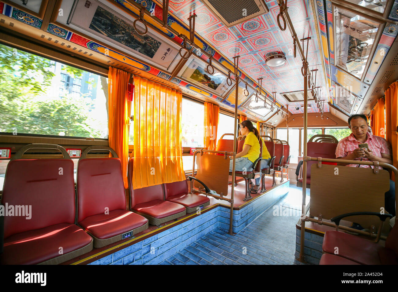 Passengers experience the old-fashioned bus in Xi’an city, northwest ...